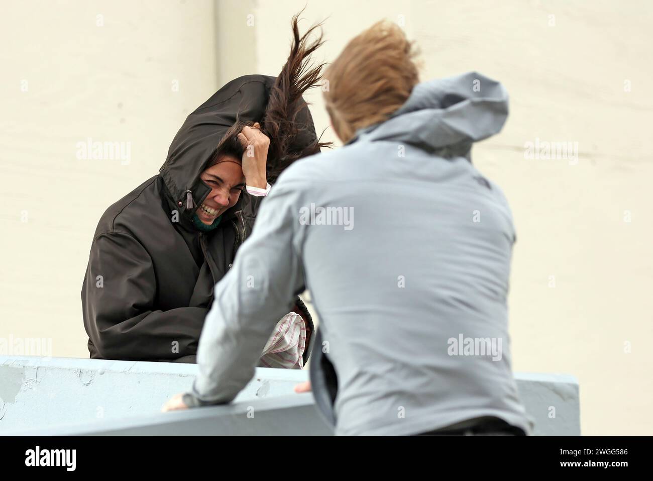 Julia Morelli and Sam Jackson battle the fierce wind gusts along Great ...
