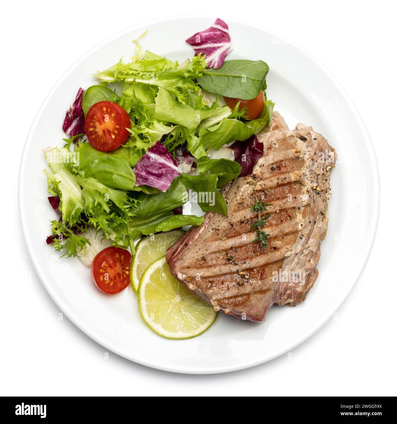 grilled cooked piece of tuna fillet on ceramic plate isolated on white ...