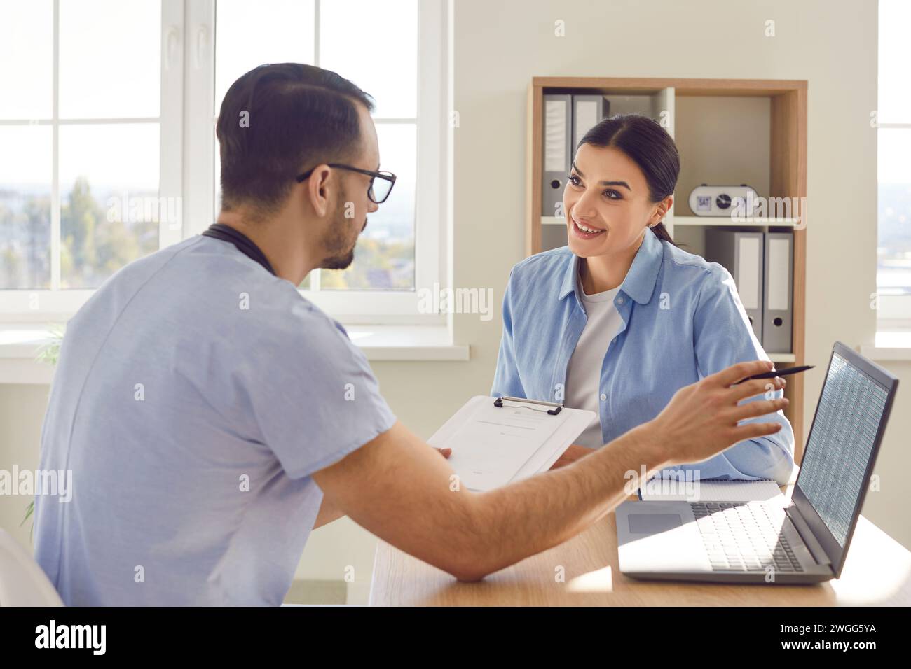 Doctor Utilizing Technology for Patient Care in Hospital Office Stock ...