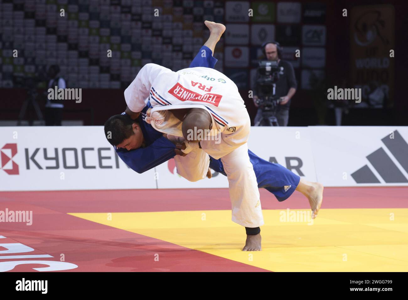 Teddy Riner of France (white) fights against Minjong Kim of South Korea ...
