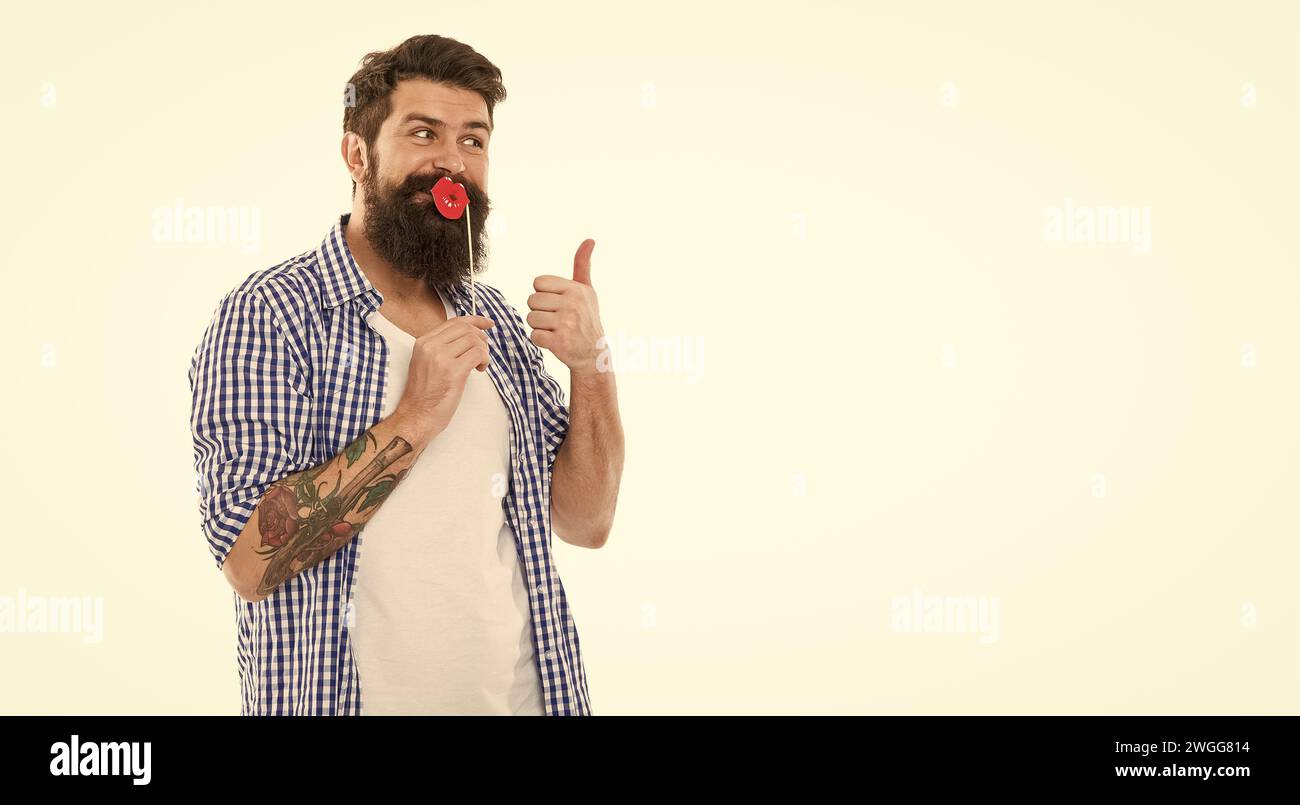 Happy smiling bearded man guy making fun with party lip props ...
