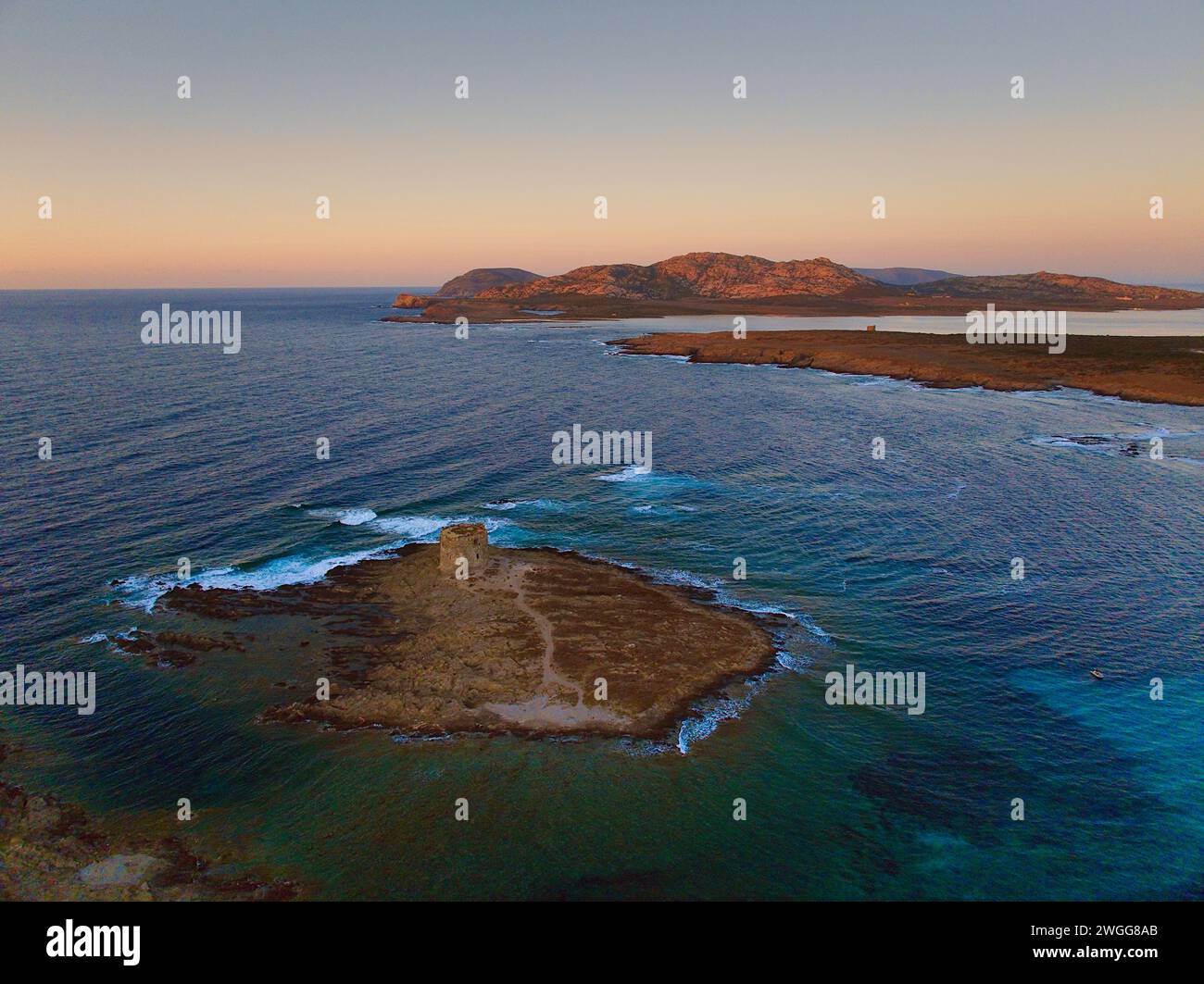 Aerial shot of Caletta della Torre islet by La Pelosa Beach, Sassari ...