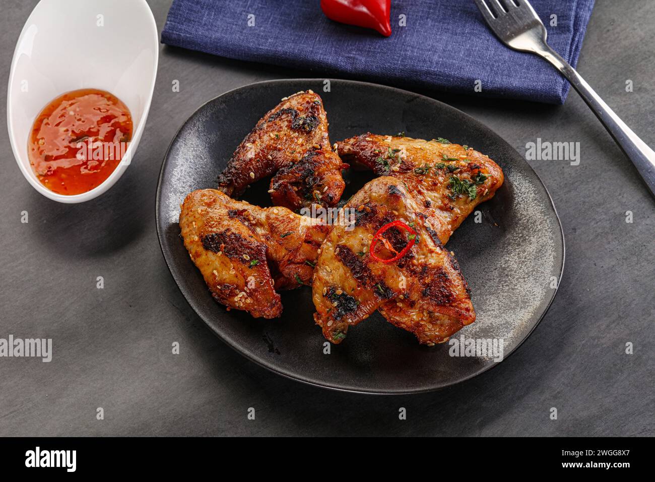 Buffalo grilled chicken wings barbecue with sauce Stock Photo - Alamy