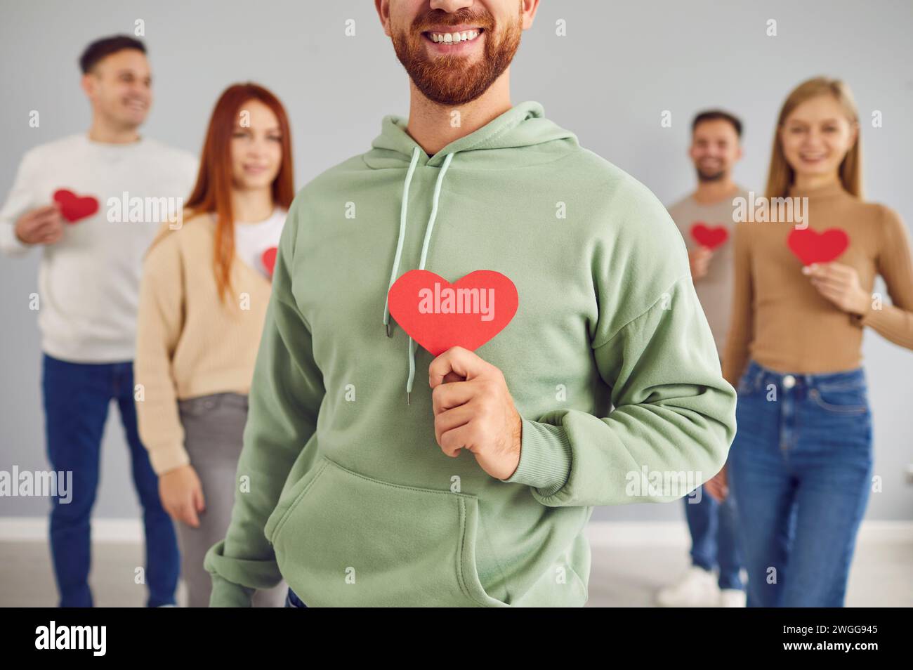 Group smiling people showing heart hi-res stock photography and images ...