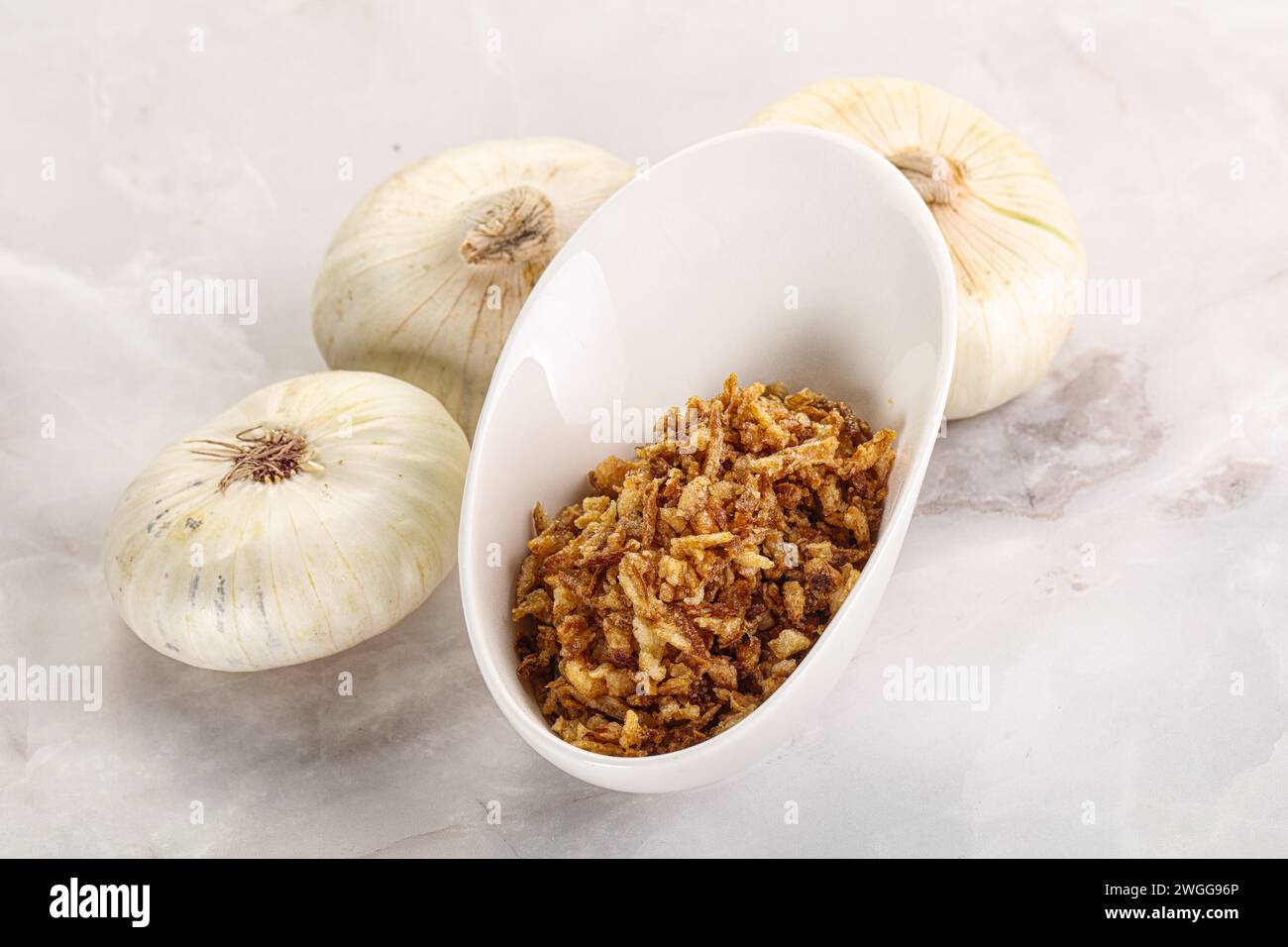 Dried roasted onion crunchy flakes for culinary Stock Photo - Alamy