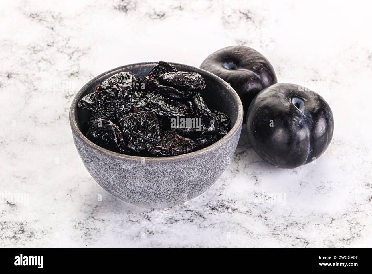 Dry sweet prunes in thw bowl Stock Photo - Alamy