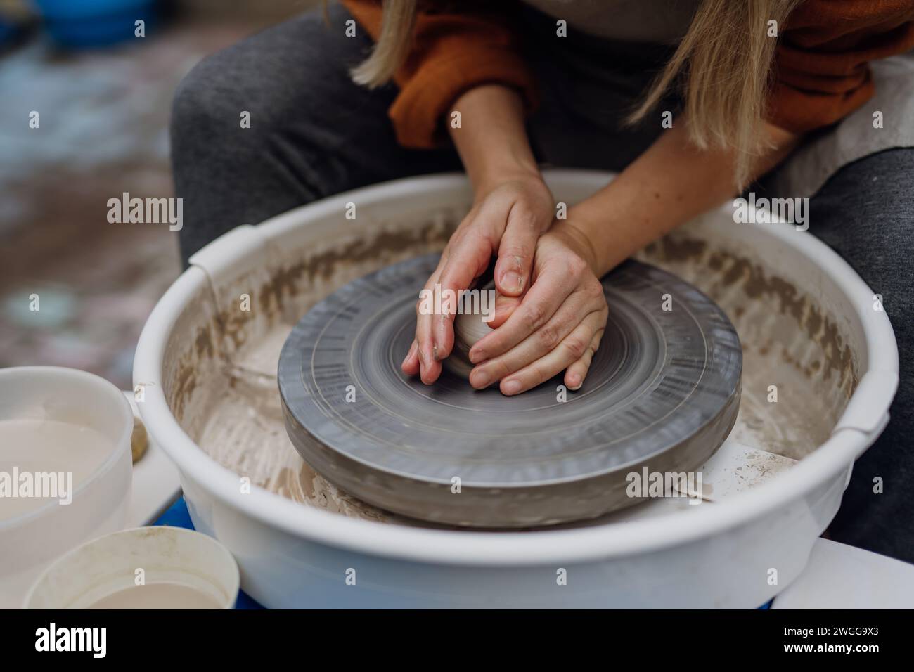 Close up woman doing pottery on pottery wheel. Child creative ...