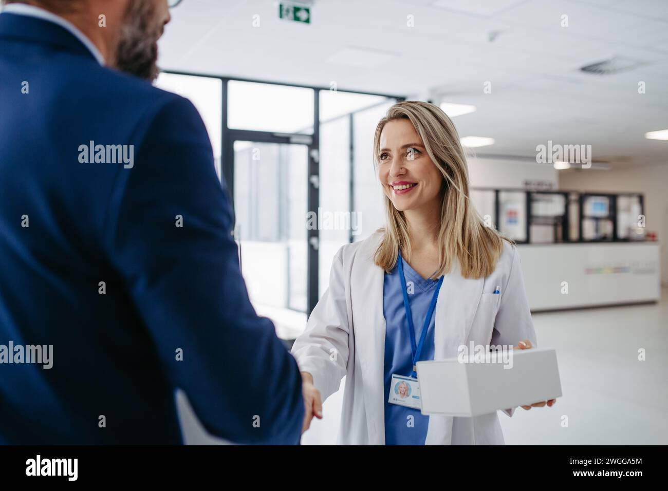 Doctor talking pharmaceutical sales rep hi-res stock photography and ...