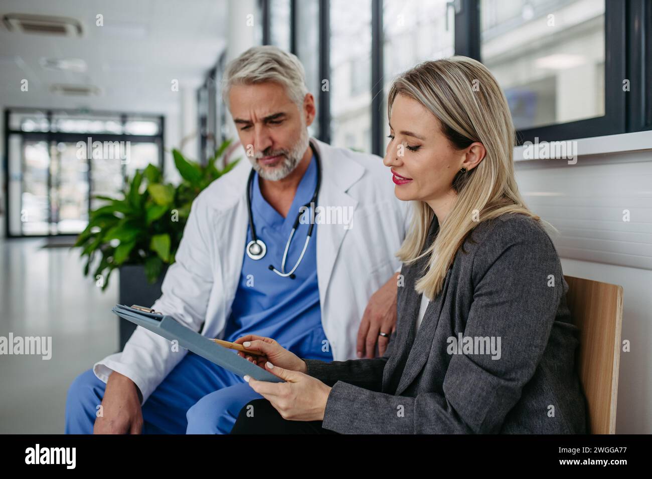 Female doctor multitasking hi-res stock photography and images - Alamy