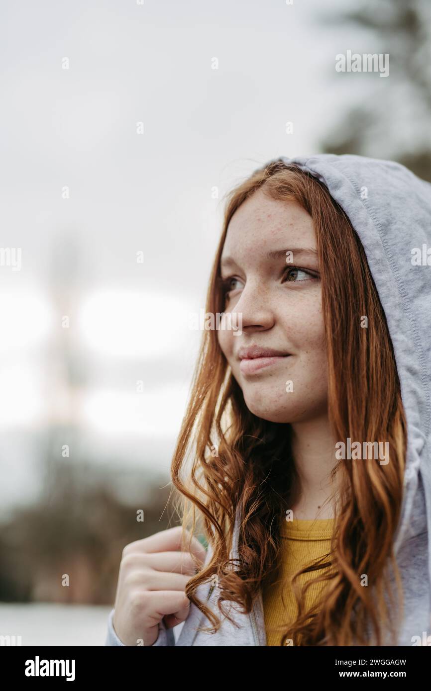 Portrait of beutiful red head gen z girl outdoors. Girl with copper ...