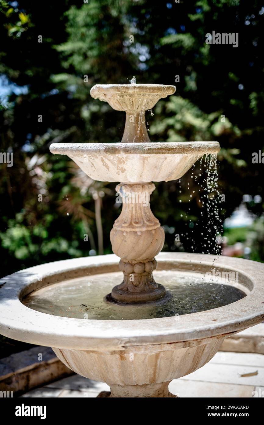 FOUNTAIN & WATER FLOW in natural beutiful light. close up on drops and ...