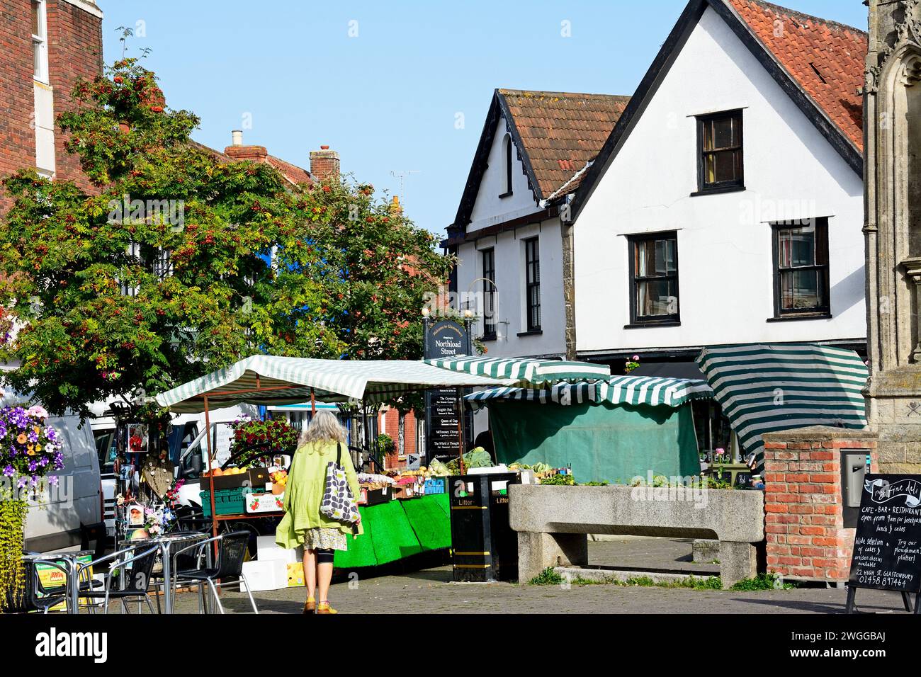 Market stalls in the Market Place in the town centre with part of the ...