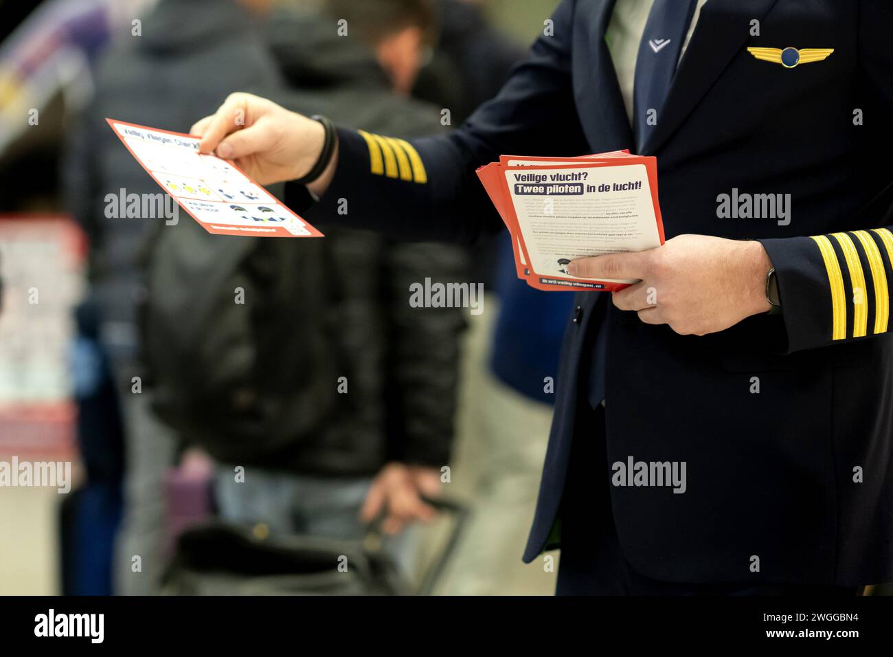 SCHIPHOL - Pilots hand out flyers during a campaign at Schiphol Airport ...