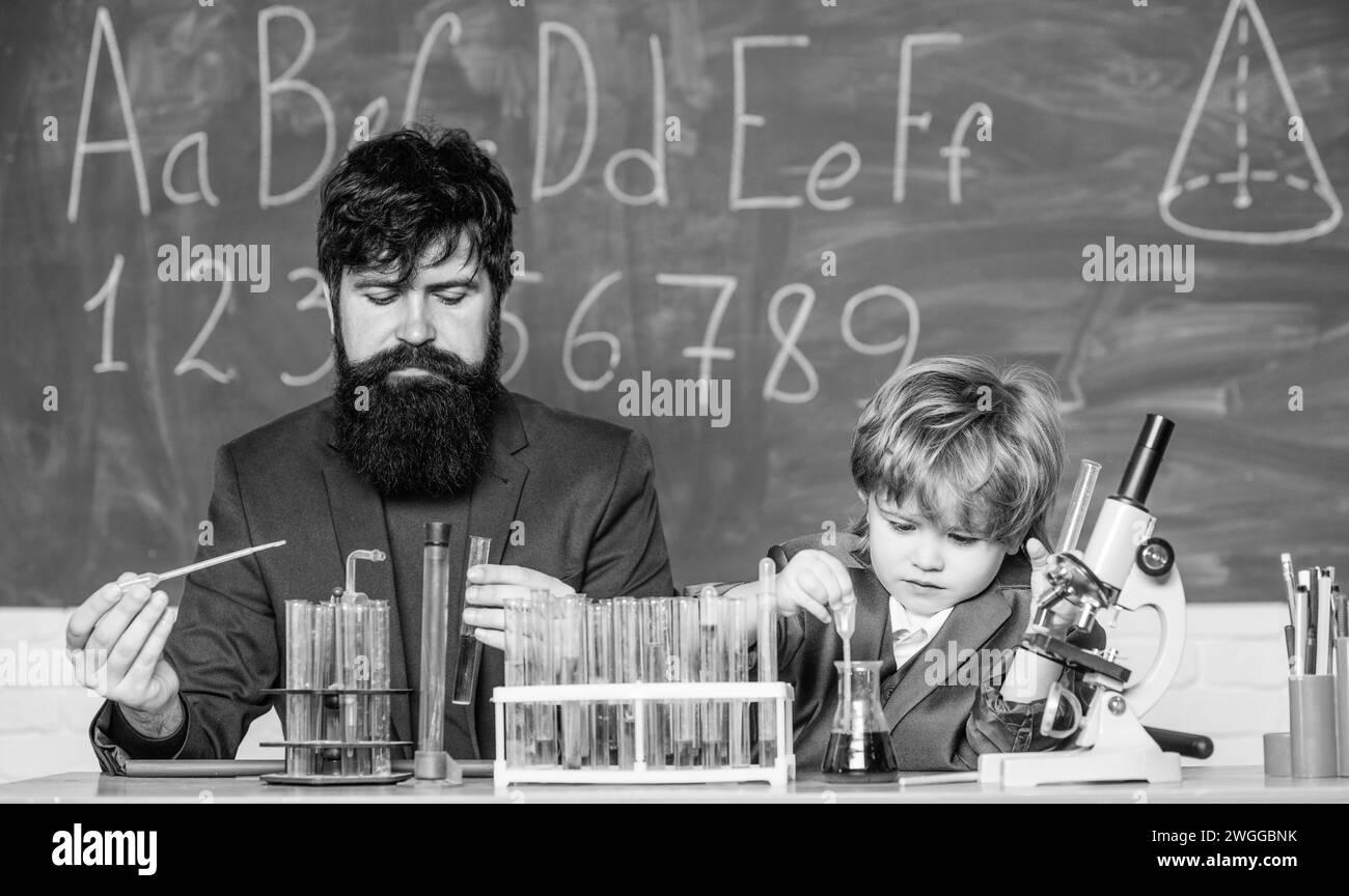 learning chemistry in school lab. Back to school. father and son at ...