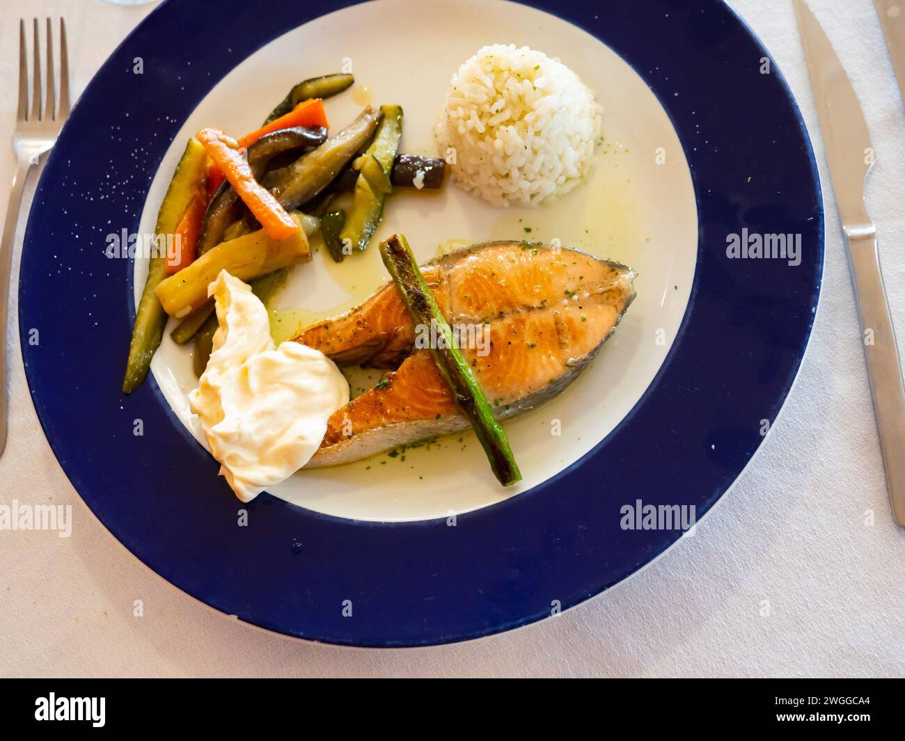 Baked salmon served with rice and vegetables Stock Photo - Alamy