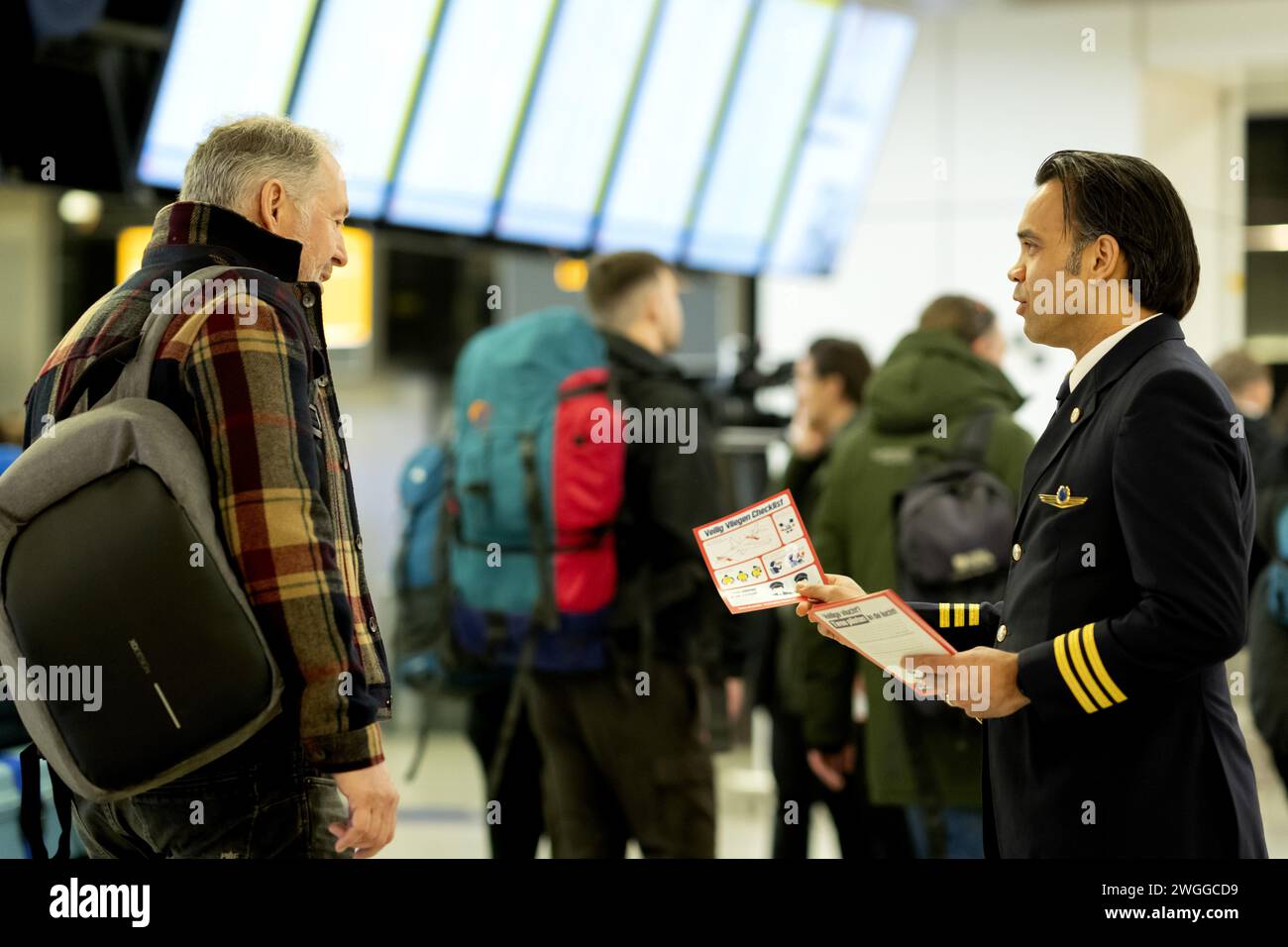 SCHIPHOL - Pilots hand out flyers during a campaign at Schiphol Airport ...