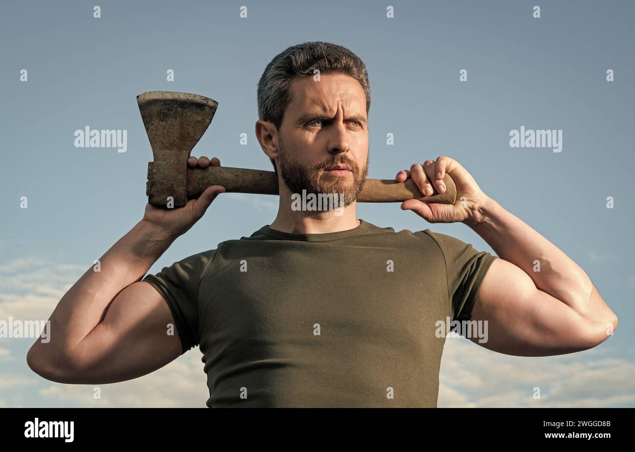 confident man with axe. caucasian woodsman man hold ax. brutal man on ...