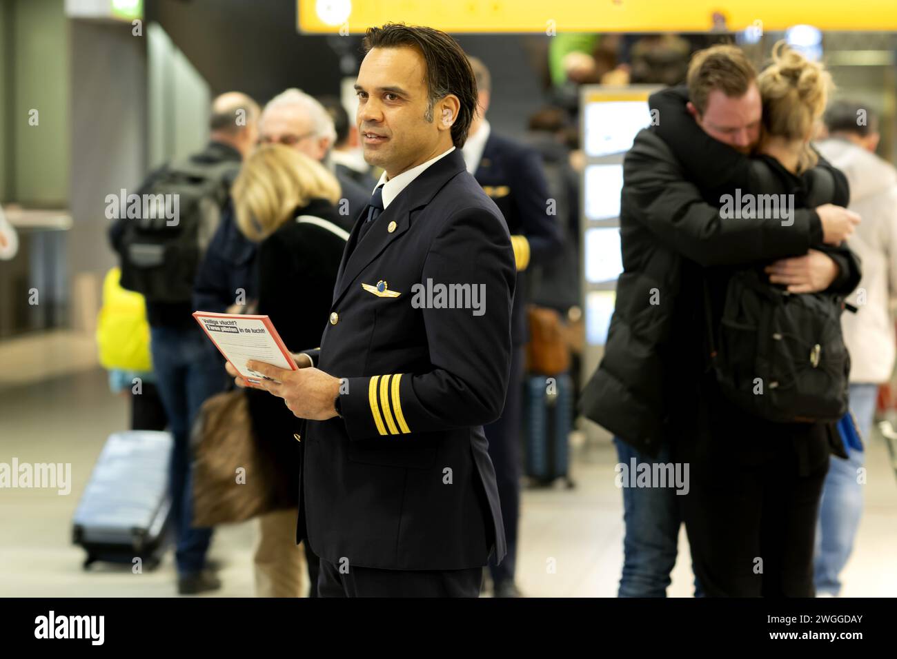 SCHIPHOL - Pilots hand out flyers during a campaign at Schiphol Airport ...