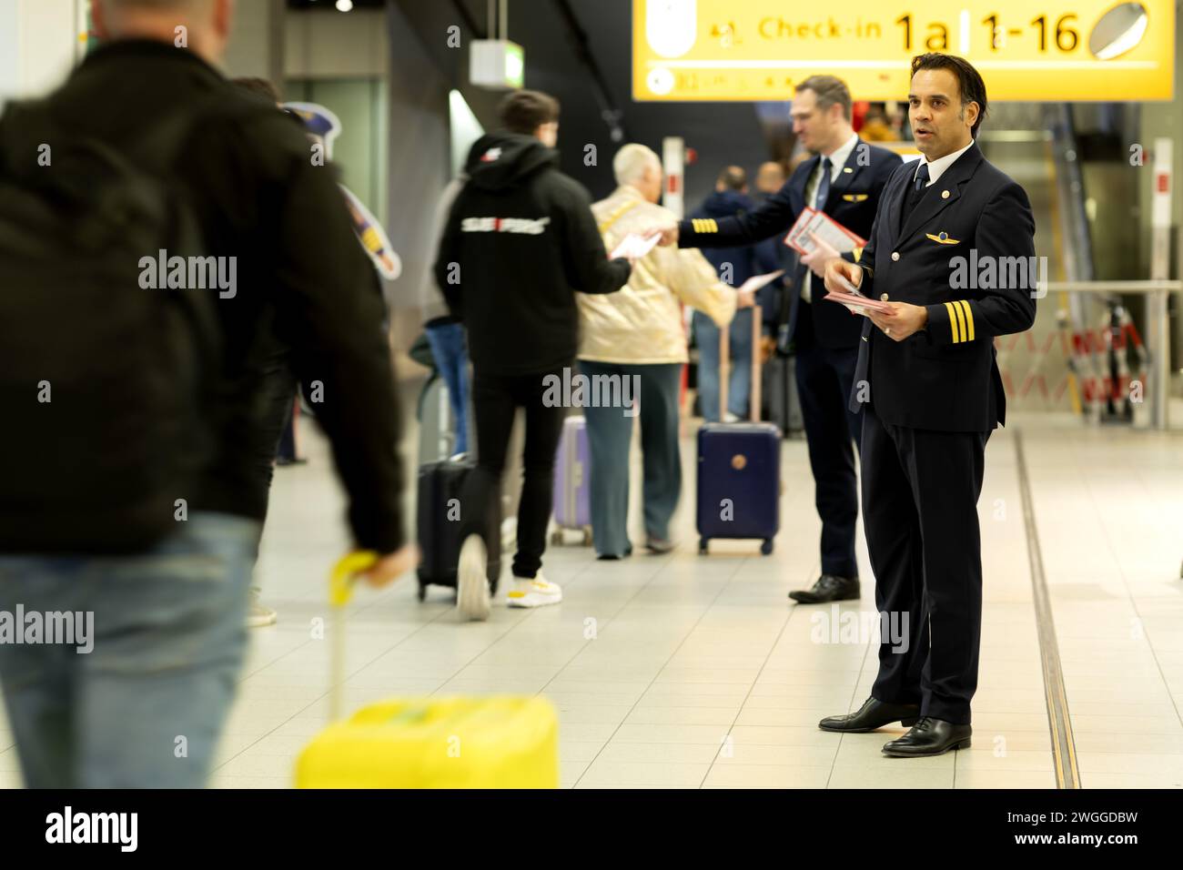 SCHIPHOL - Pilots hand out flyers during a campaign at Schiphol Airport ...