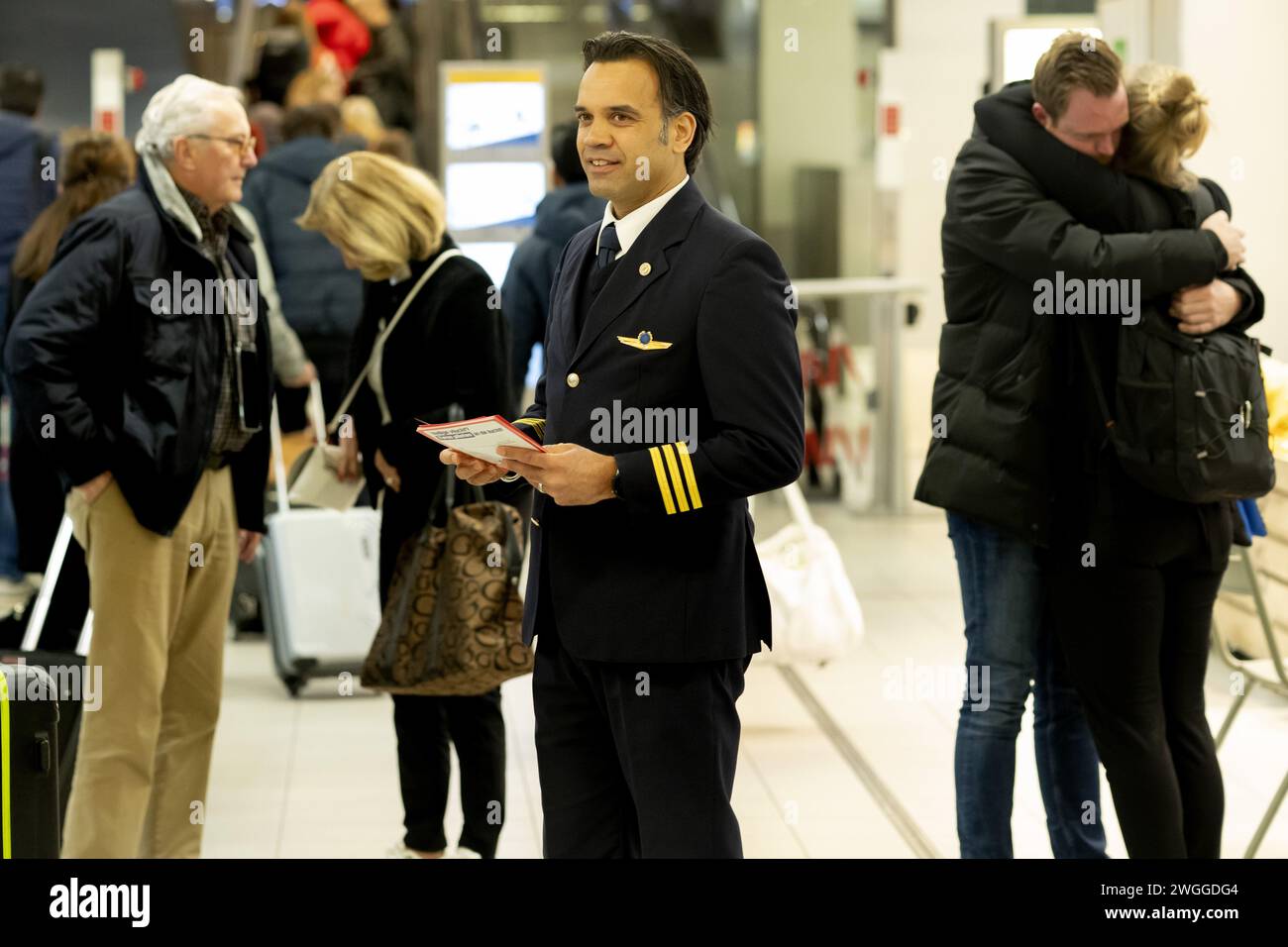 SCHIPHOL - Pilots hand out flyers during a campaign at Schiphol Airport ...