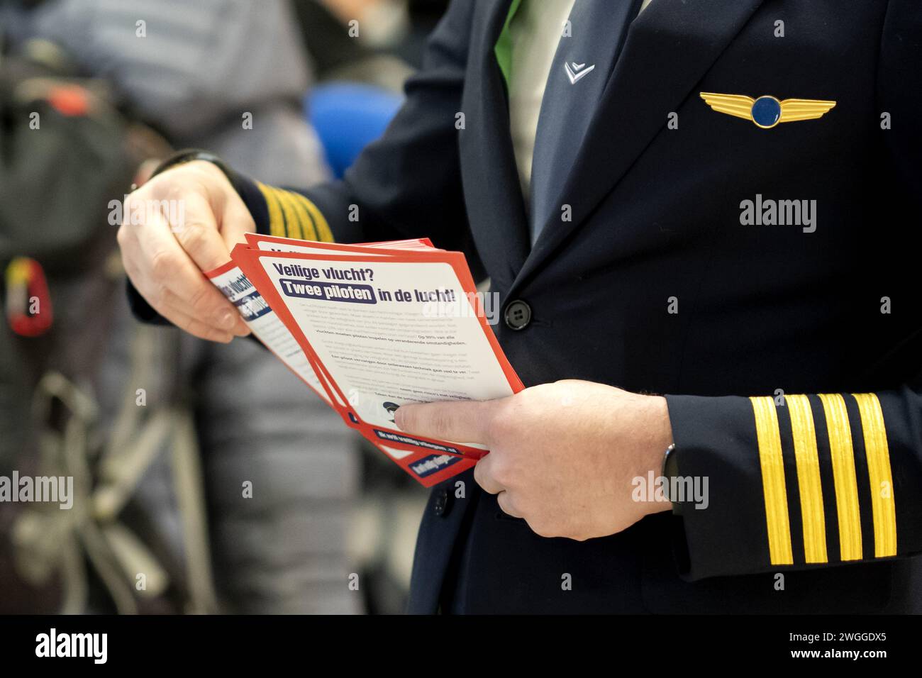 SCHIPHOL - Pilots hand out flyers during a campaign at Schiphol Airport ...
