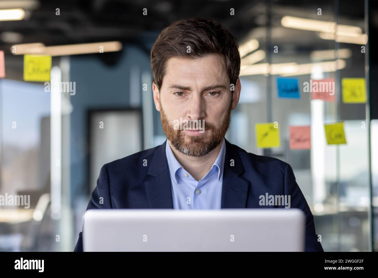 Looking closely at a computer screen hi-res stock photography and ...