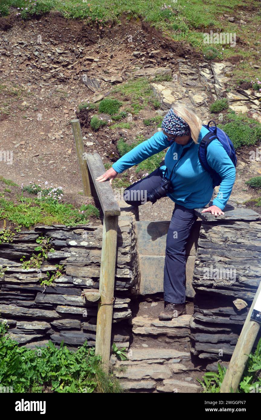 Woman (Hiker) Climbing Stone Slate Stile near Middle Merope Island on ...