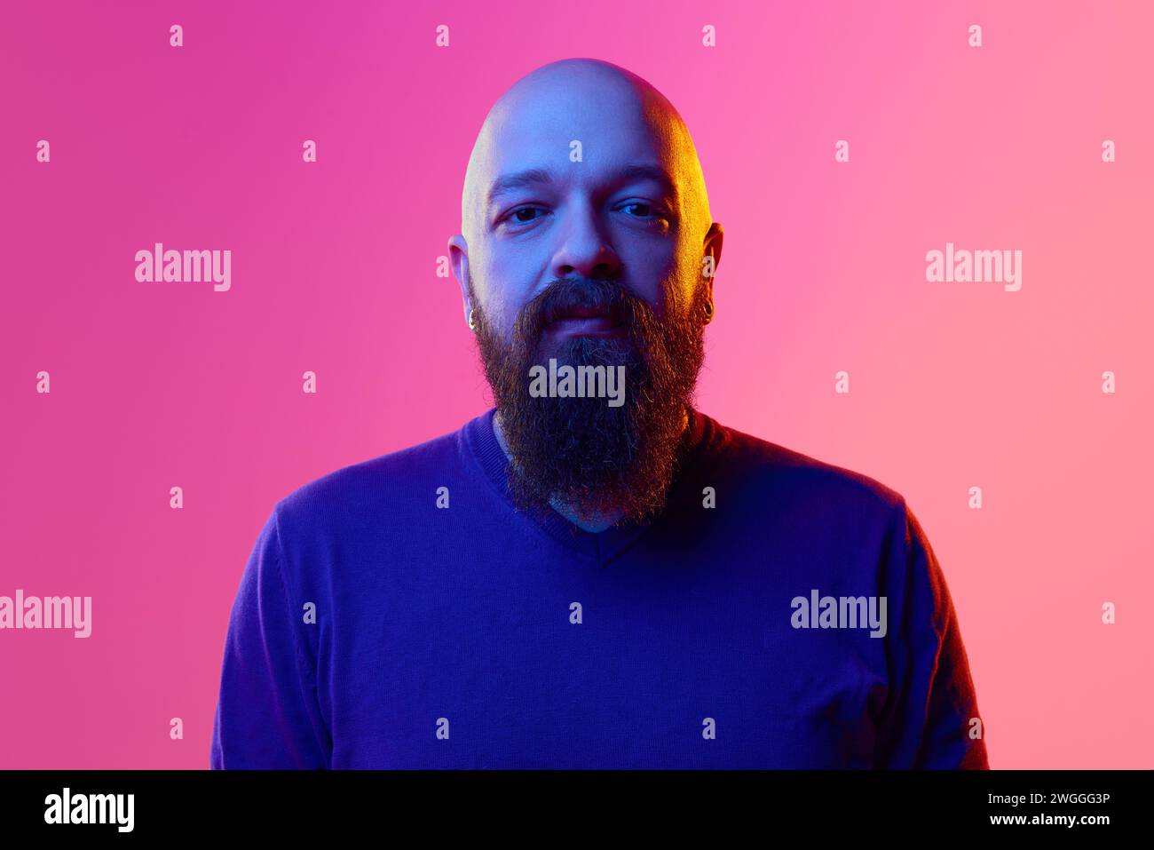 Portrait of bard bearded man in his 30s wearing blue sweater, looking ...