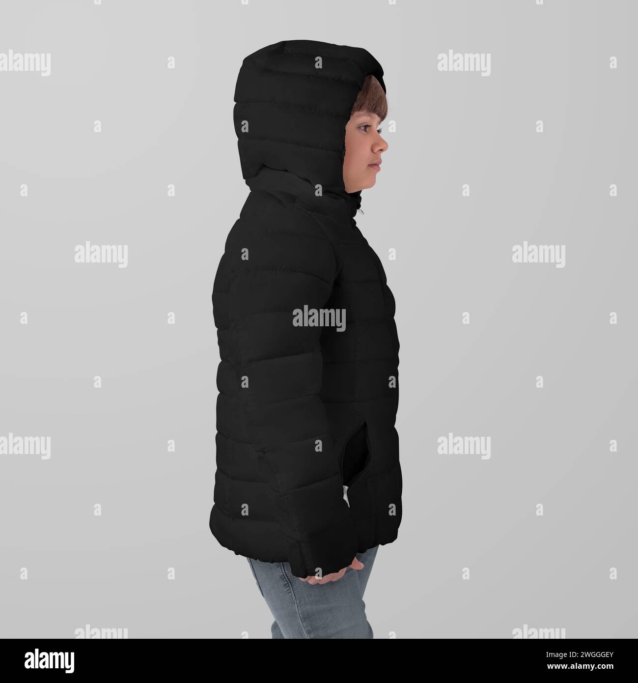 Mockup of a black winter kids puffer jacket on a girl in hoodie, side ...