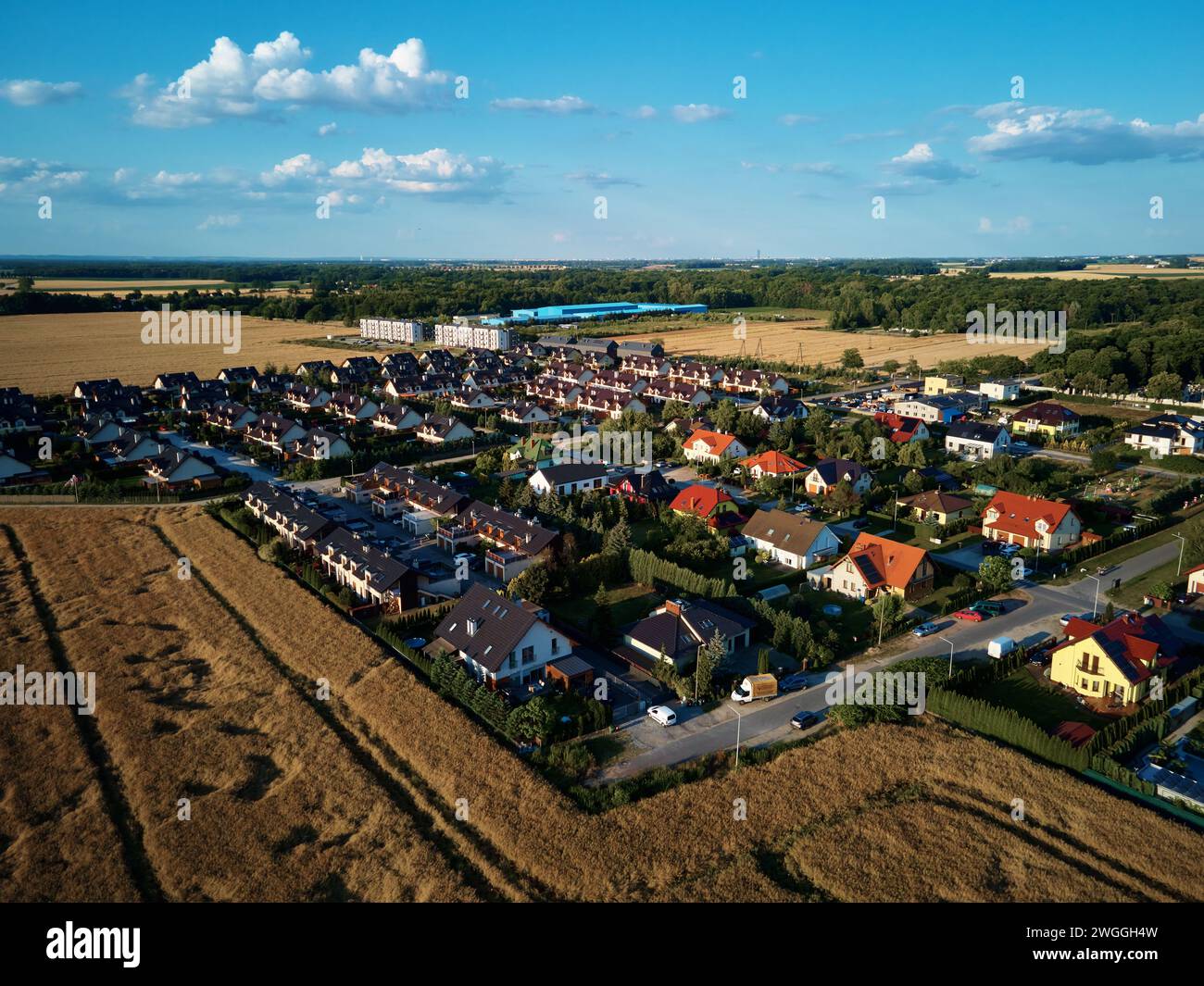 Residential houses in small town near agricultural field, bird eye view ...