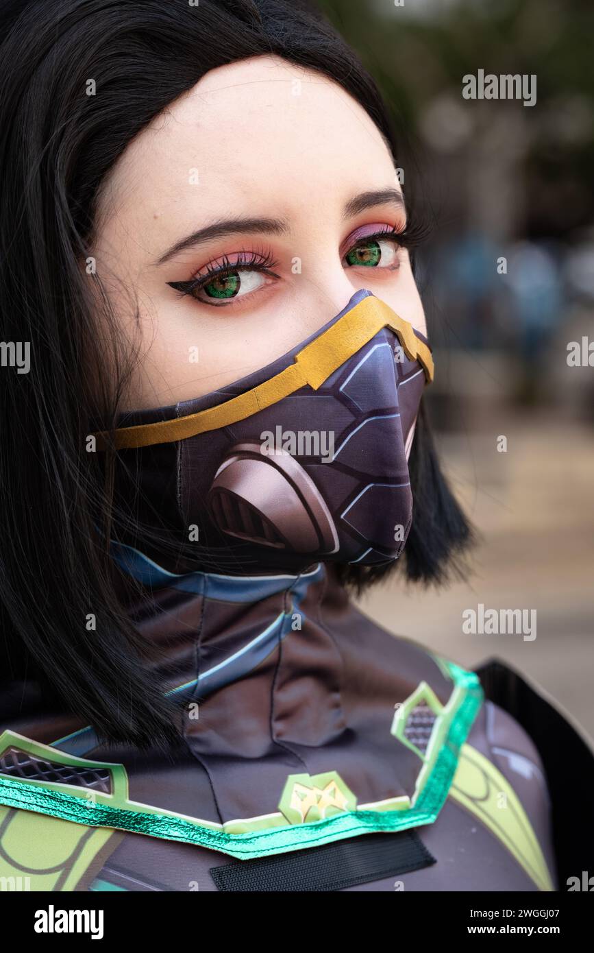A closeup portrait of a female cosplayer in a green action suit Stock ...