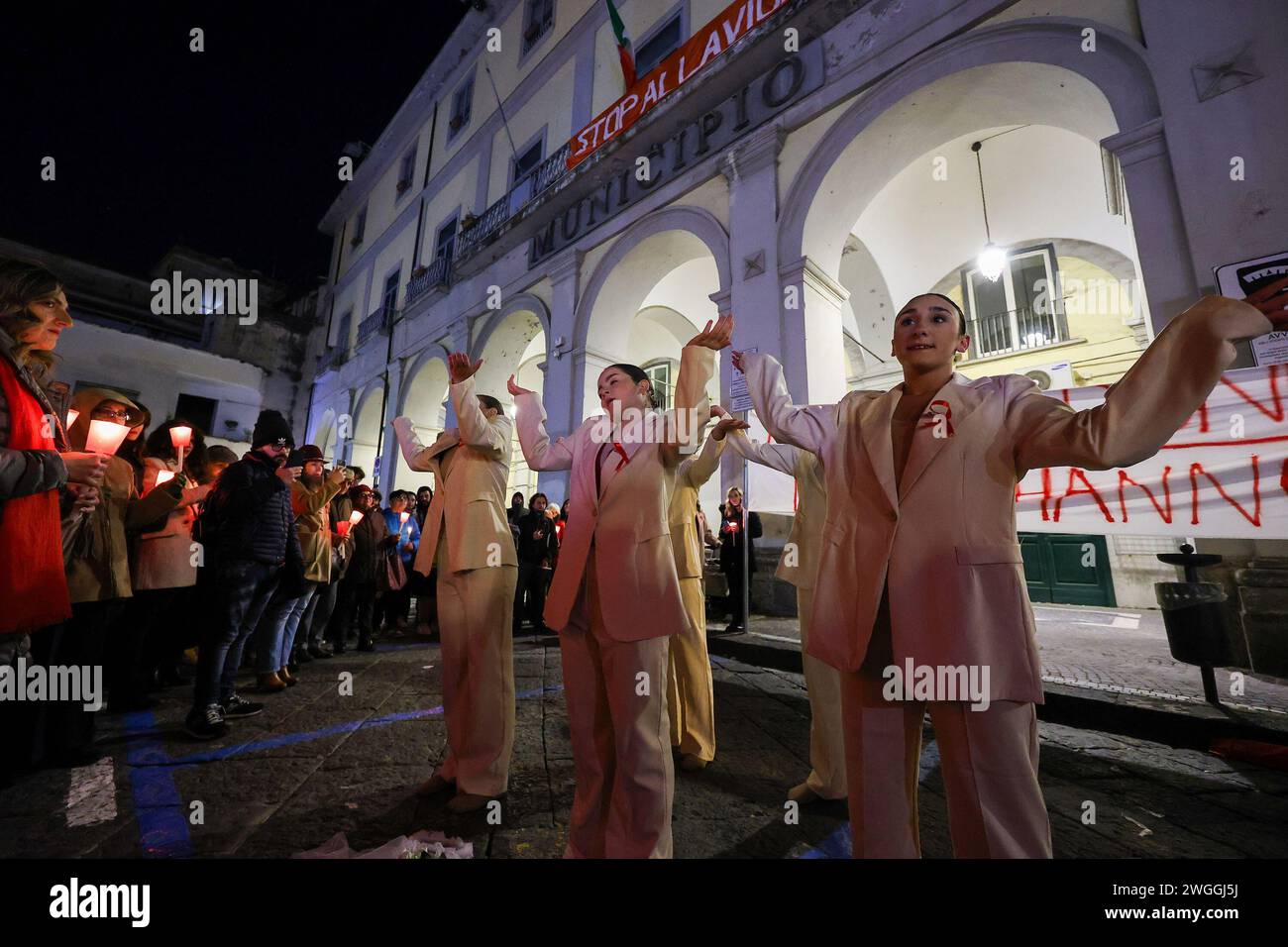 A group of dancers performs during a torchlight procession for the ...