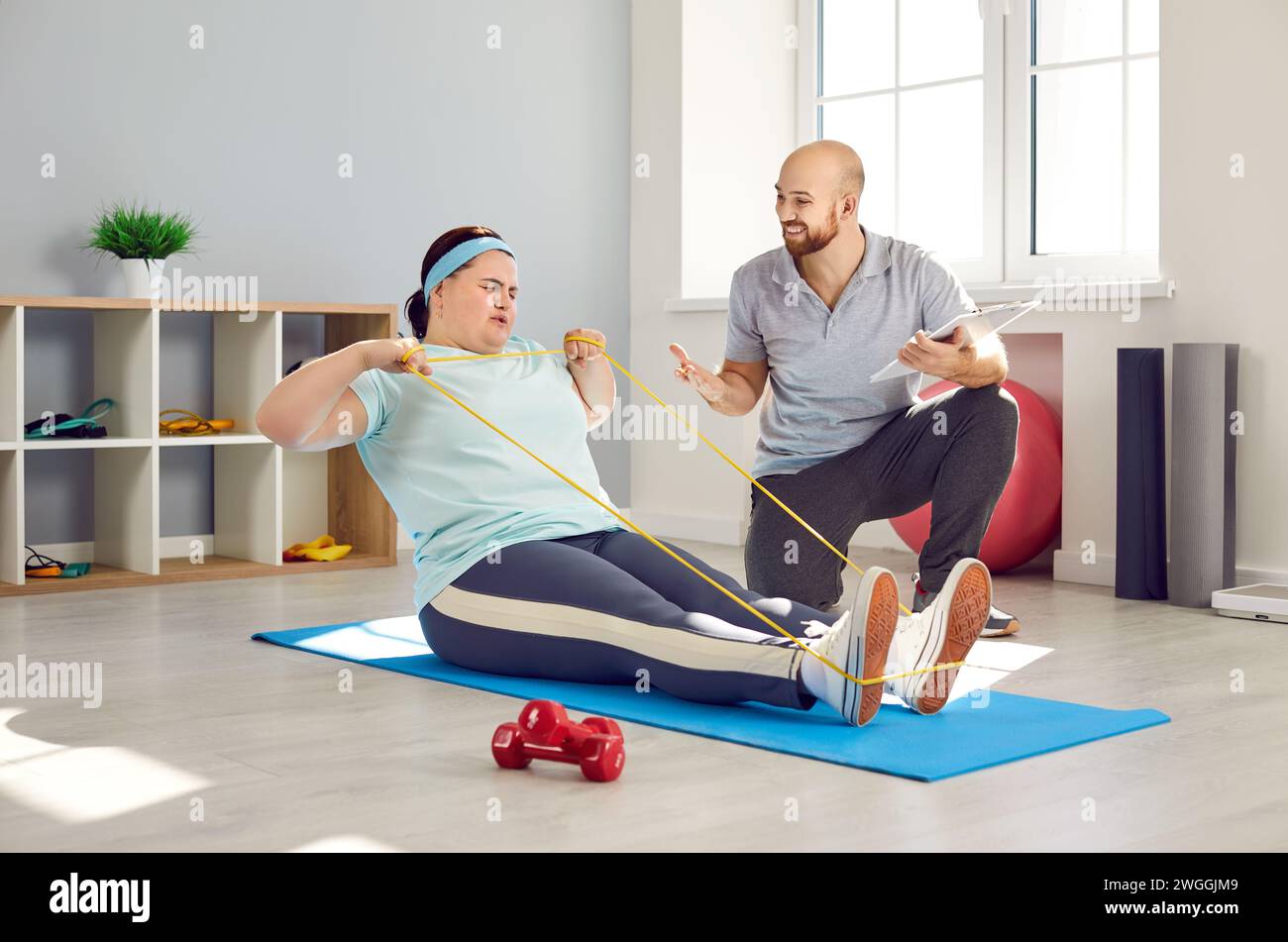 Overweight man trainer in hi-res stock photography and images - Alamy