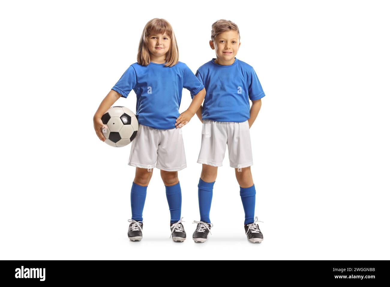 Boy and girl posing in blue and white football kits isolated on white ...
