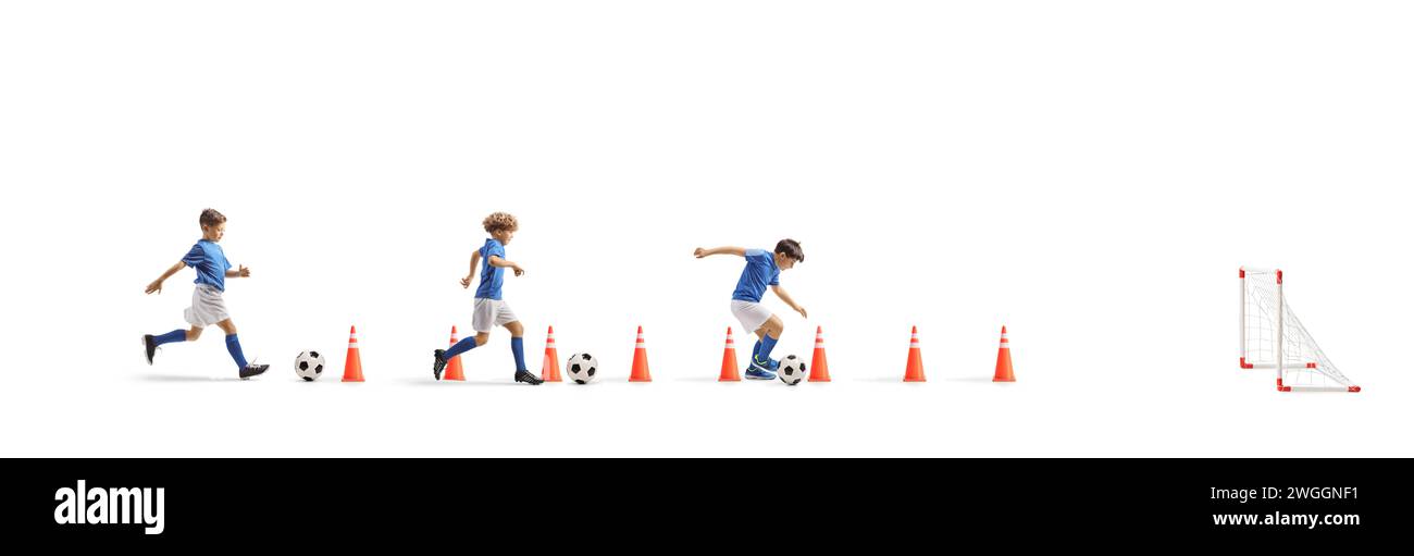 Boys training football with cone obstacles, aguility and speed training ...