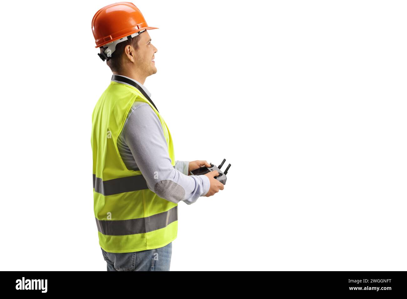 Engineer holding a drone remote controller isolated on white background ...