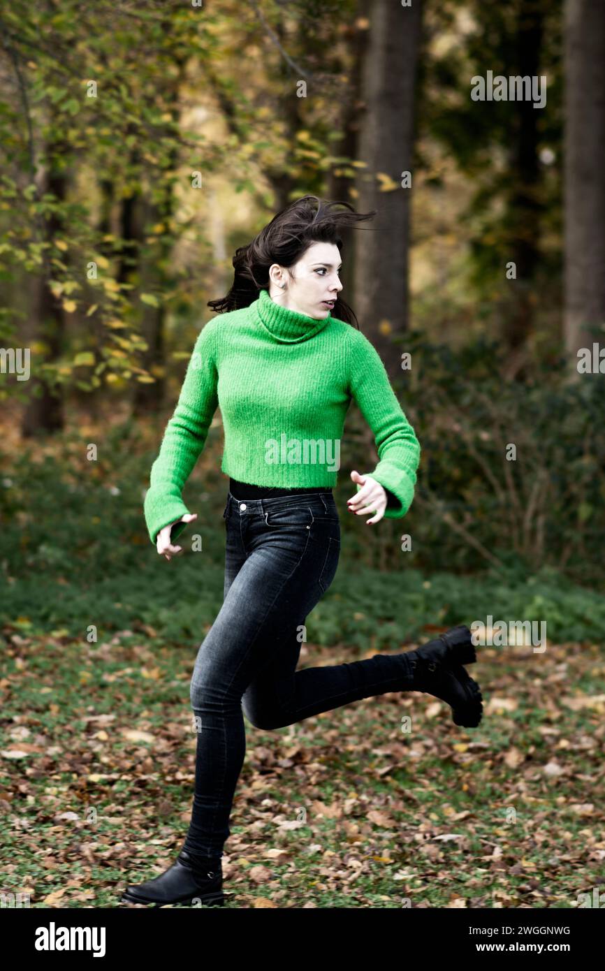 Woman running in forest back hi-res stock photography and images - Alamy