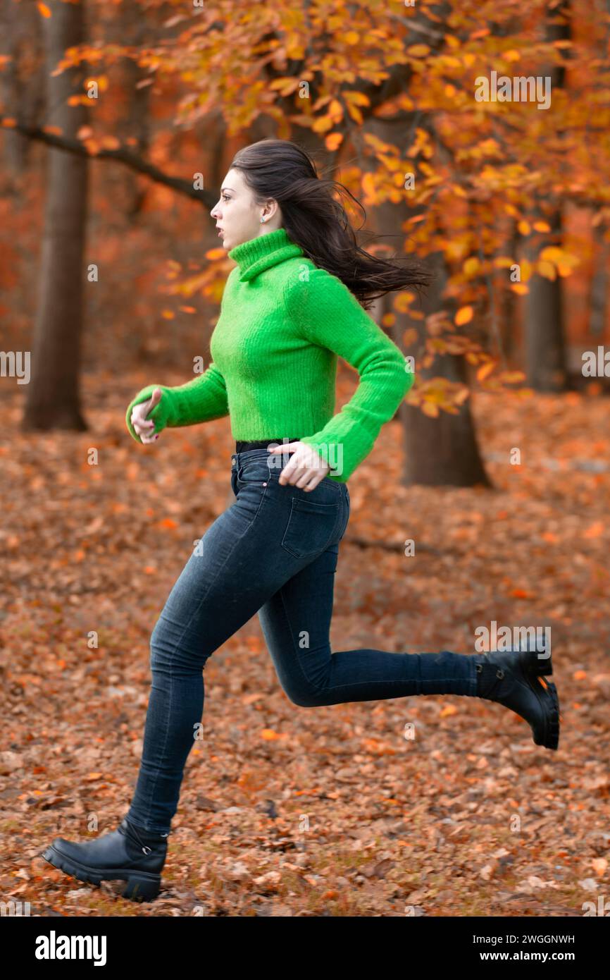 Woman scared running in woods hi-res stock photography and images - Alamy