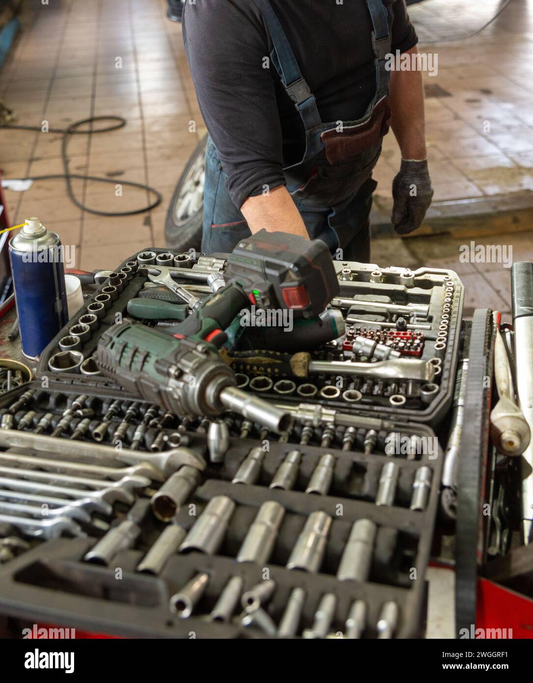 A Selective focus of mechanic's toolbox with tools in drawers, auto ...
