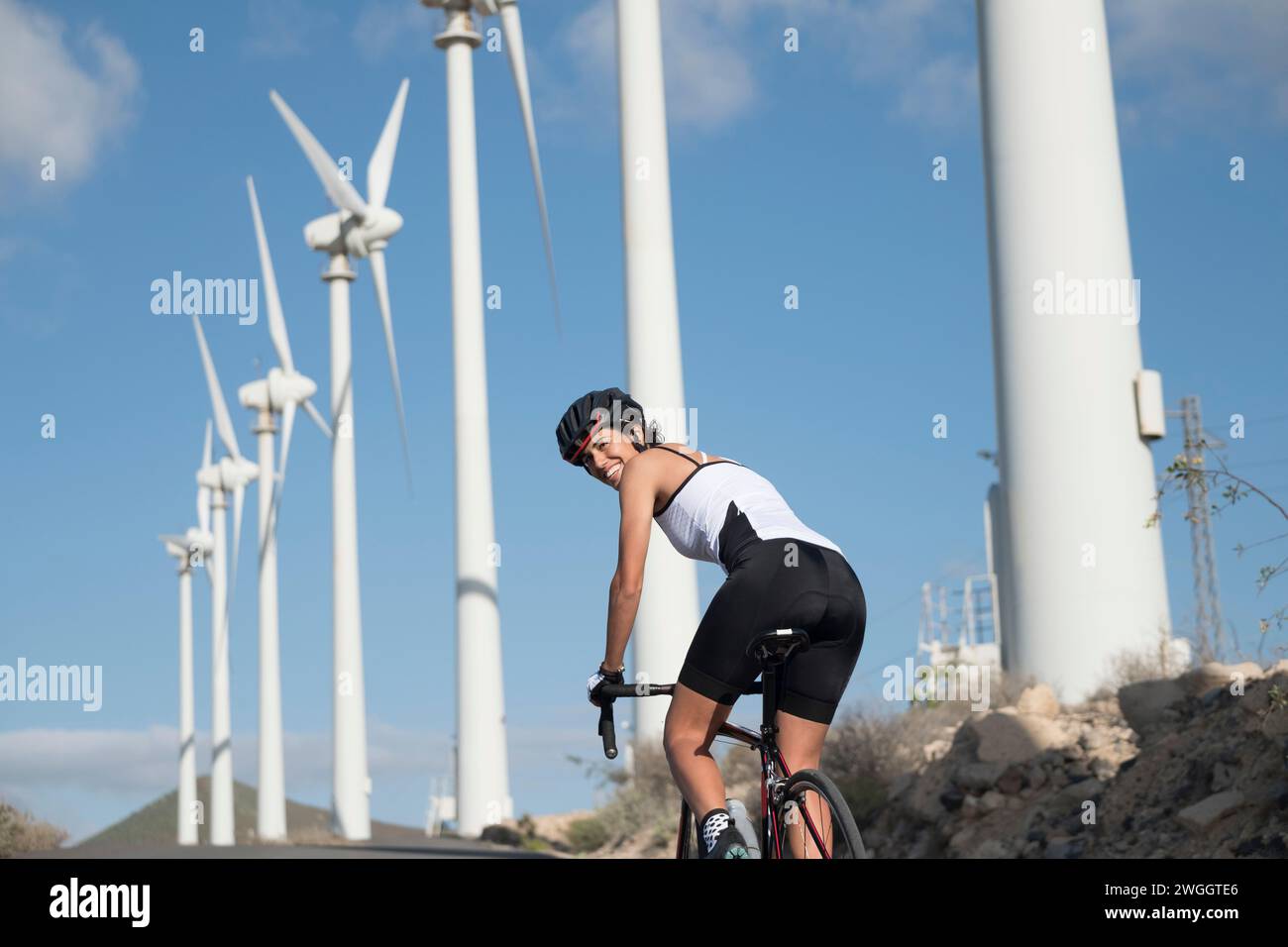 Cyclist looking over shoulder hi-res stock photography and images - Alamy