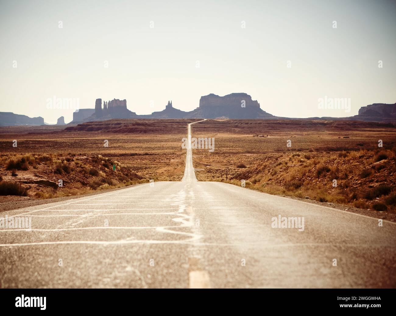A lonely road winds its way through Monument Valley in this iconic view ...