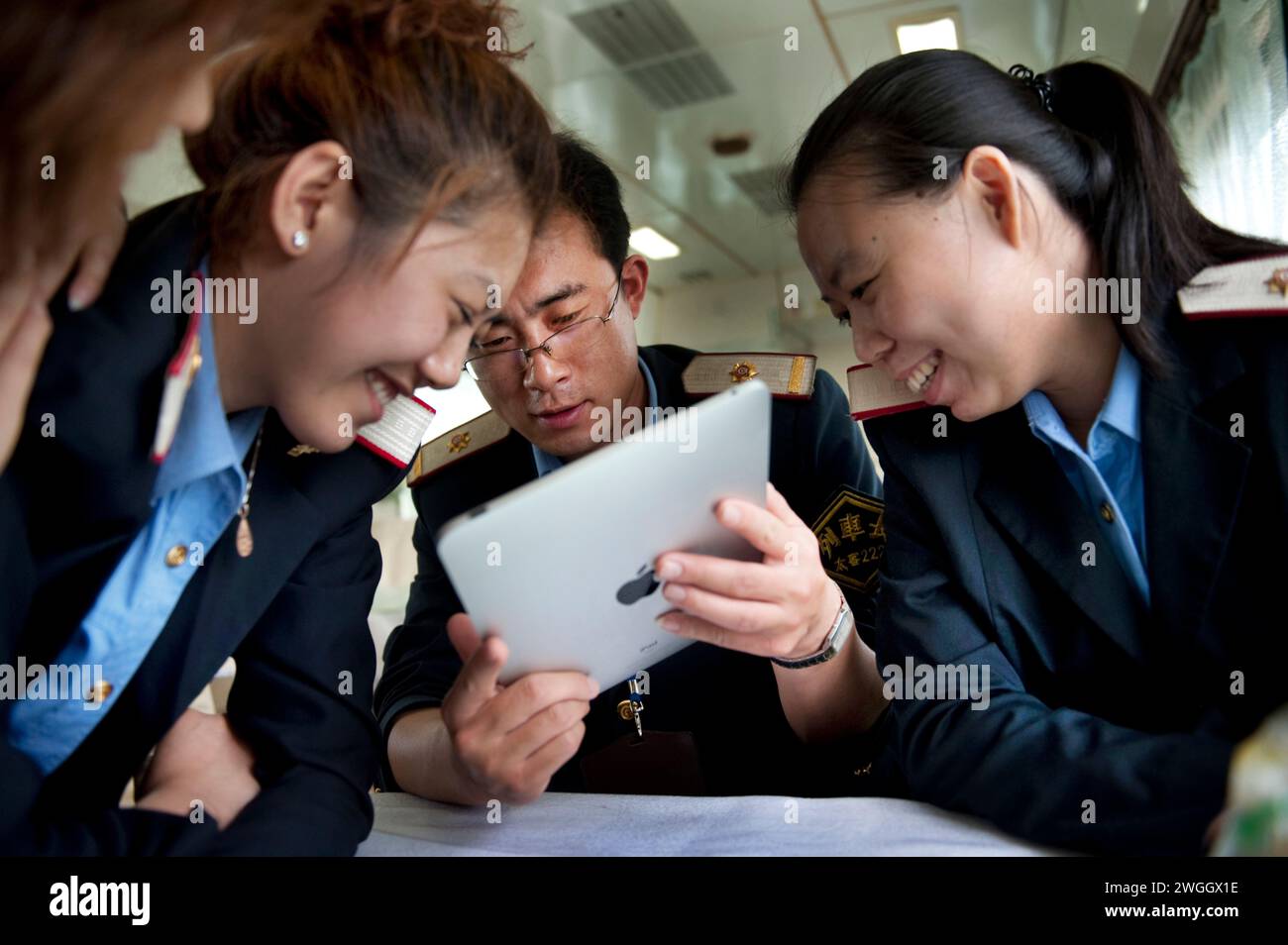 Chinese Railway officers with iPad Stock Photo - Alamy