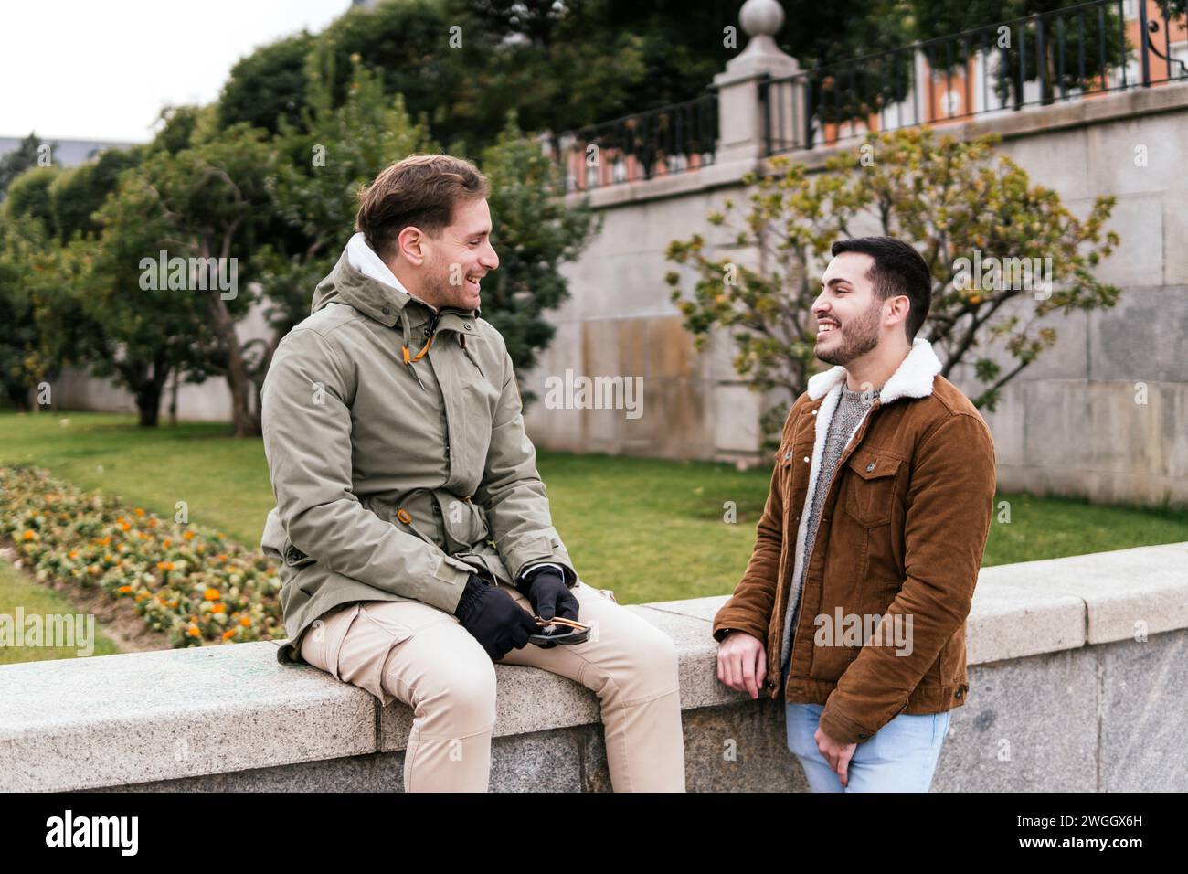 Two male friends talking street hi-res stock photography and images - Alamy