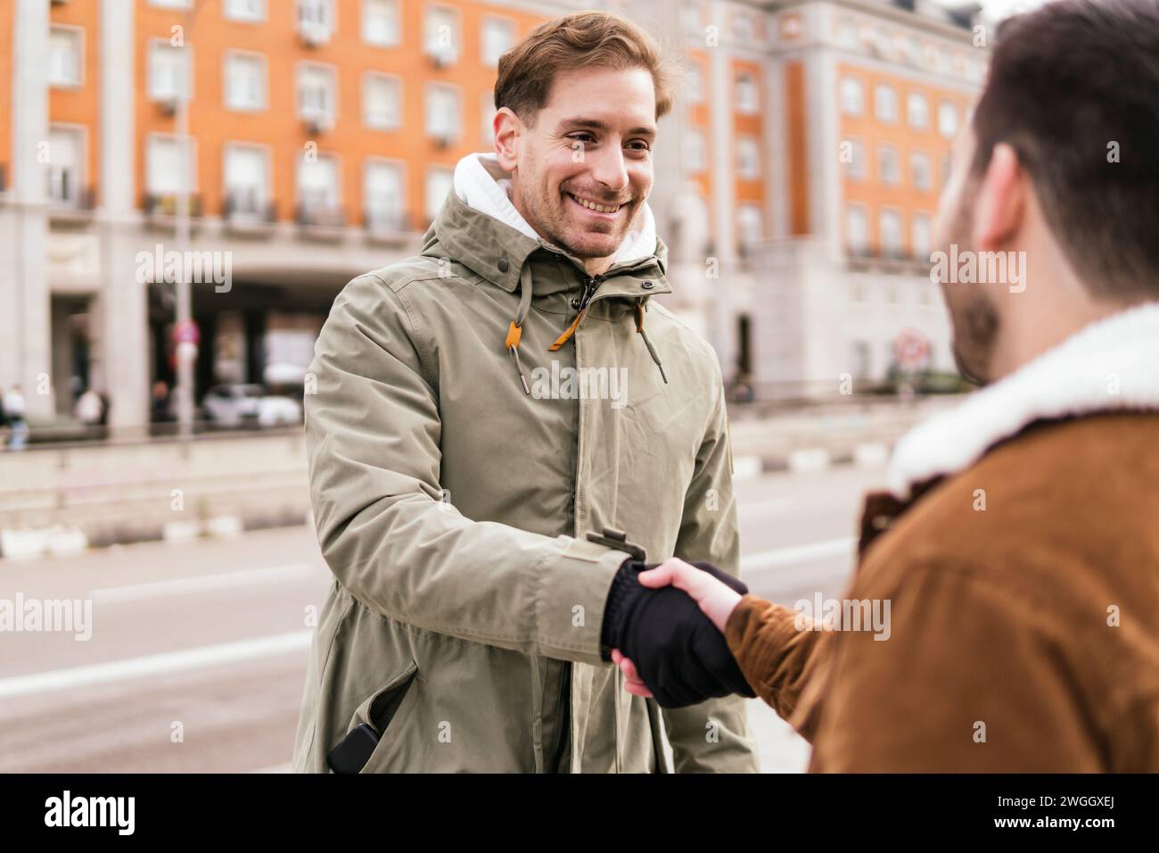 Friends greeting each other hi-res stock photography and images - Alamy