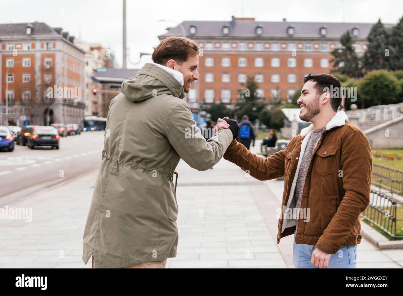 two boys shaking hands greeting each other Stock Photo - Alamy