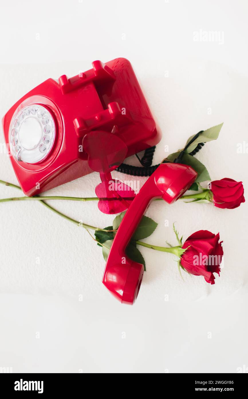 Romantic scene with roses, heart shape glasses & rotary phone Stock ...