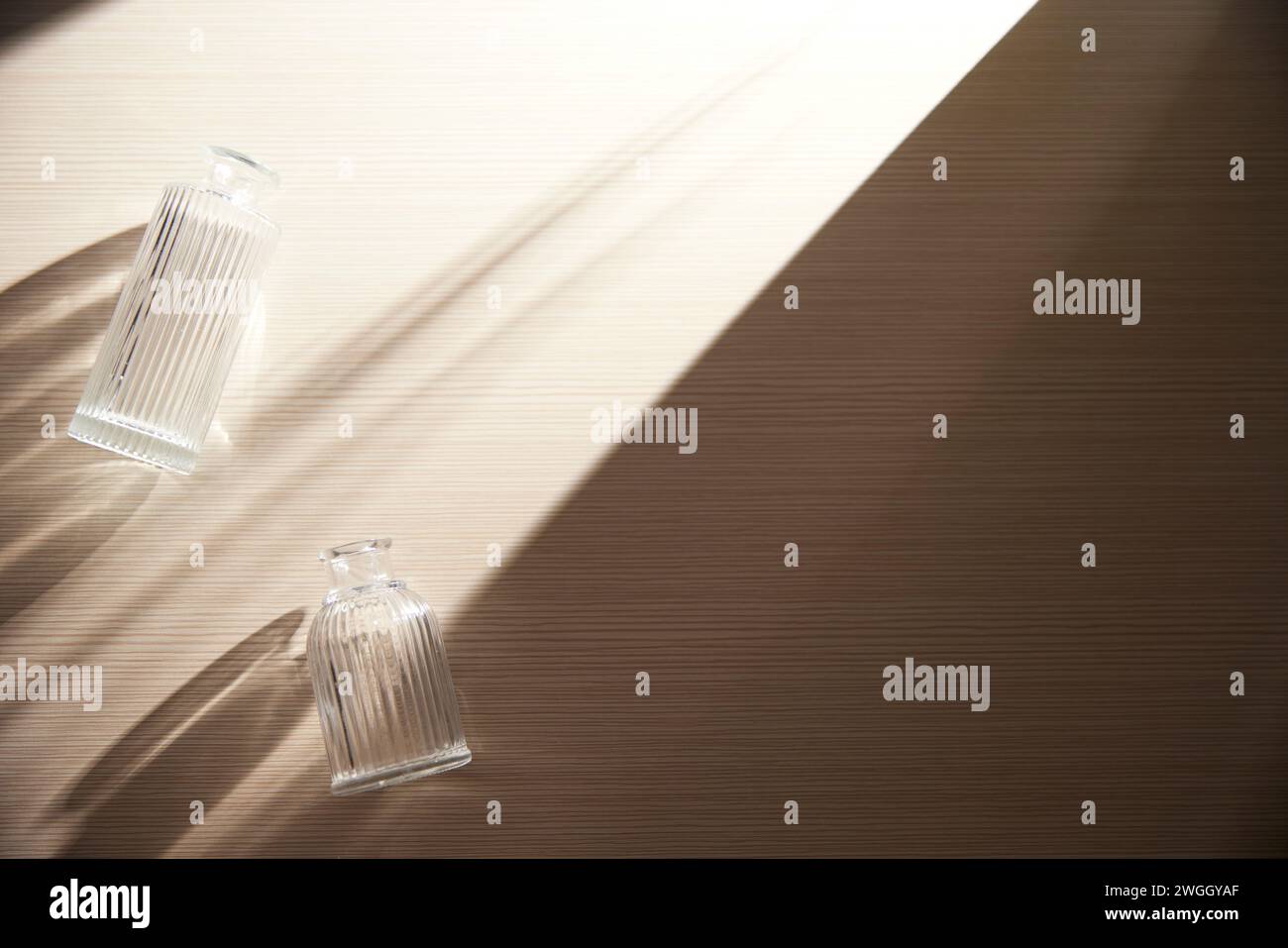 A water cup and shadow on a table in the sunlight Stock Photo - Alamy