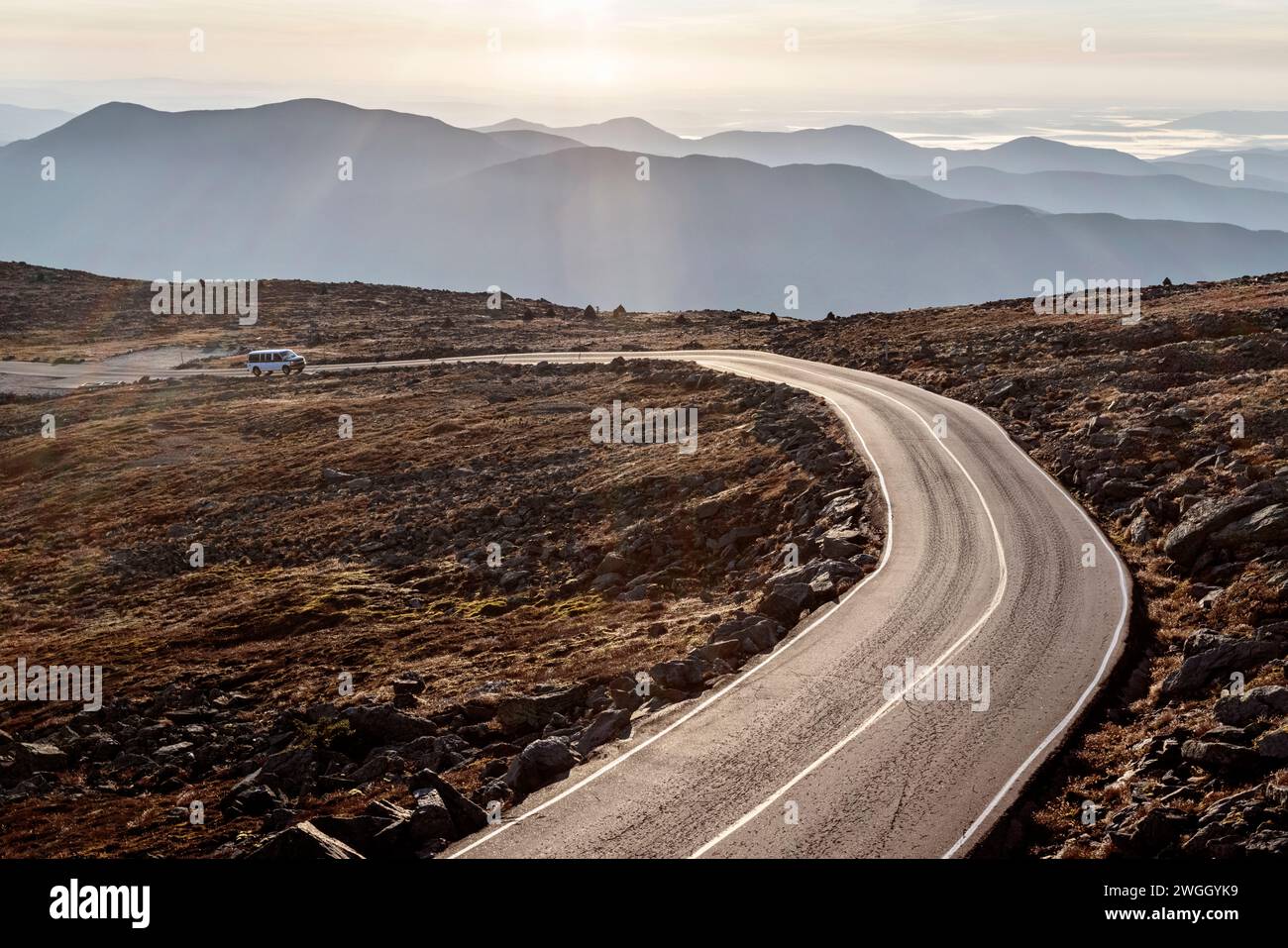A car drives up Mount Washington auto road at dawn, New Hampshire Stock ...