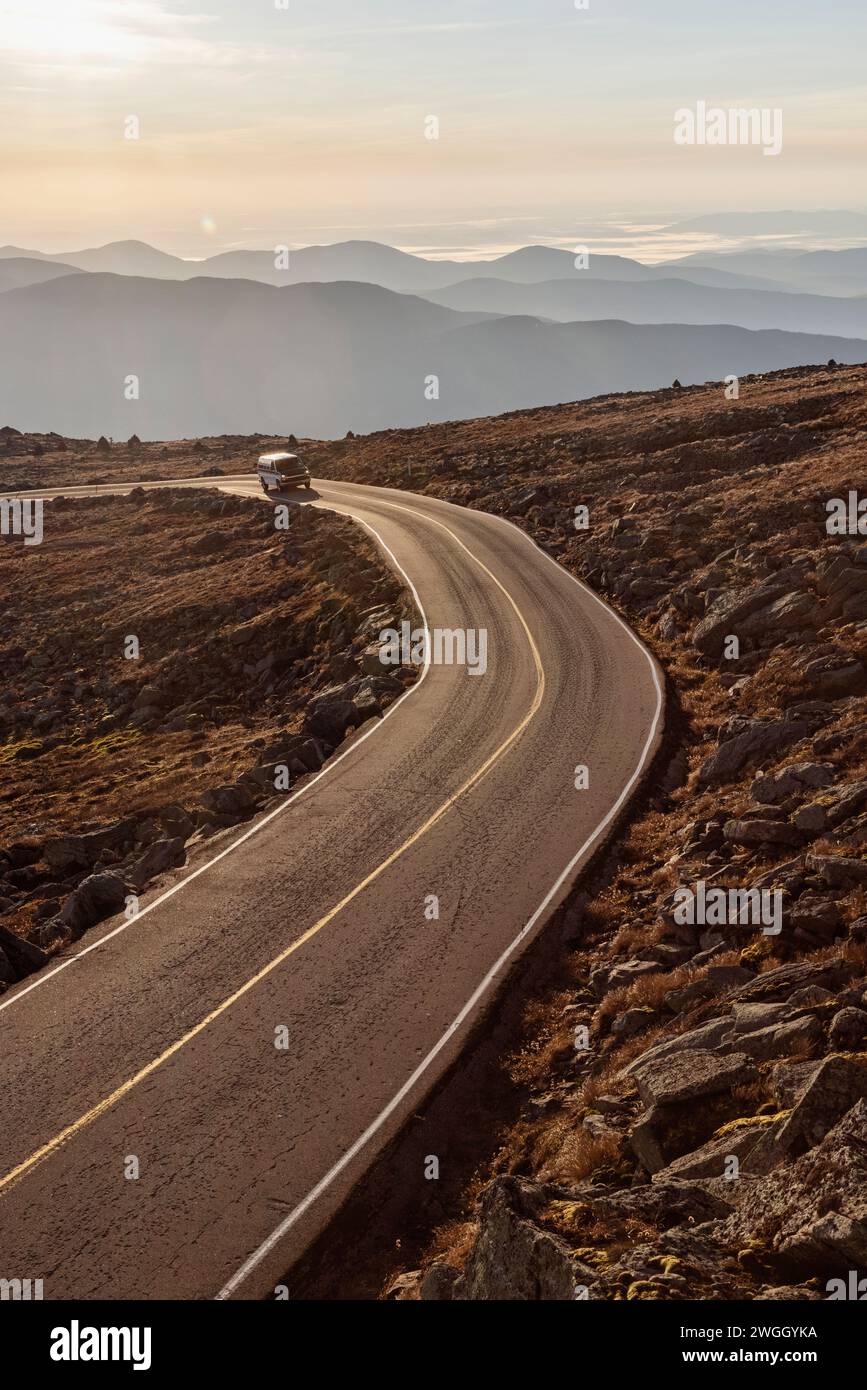A car drives up Mount Washington auto road at dawn, New Hampshire Stock ...