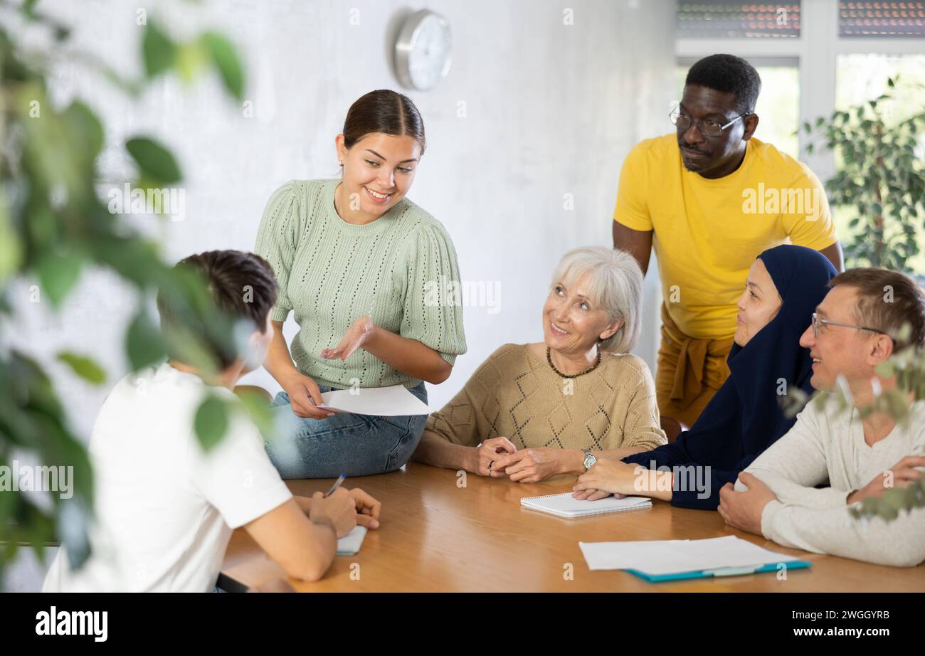 Men and women different ages discussion during business course in ...